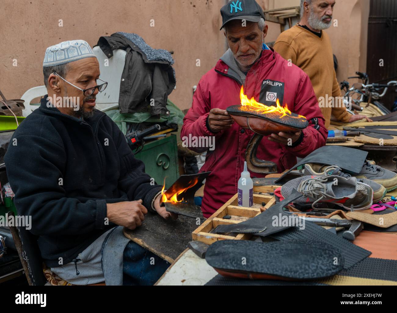 Shoemaker glueing old shoe hi-res stock photography and images - Alamy