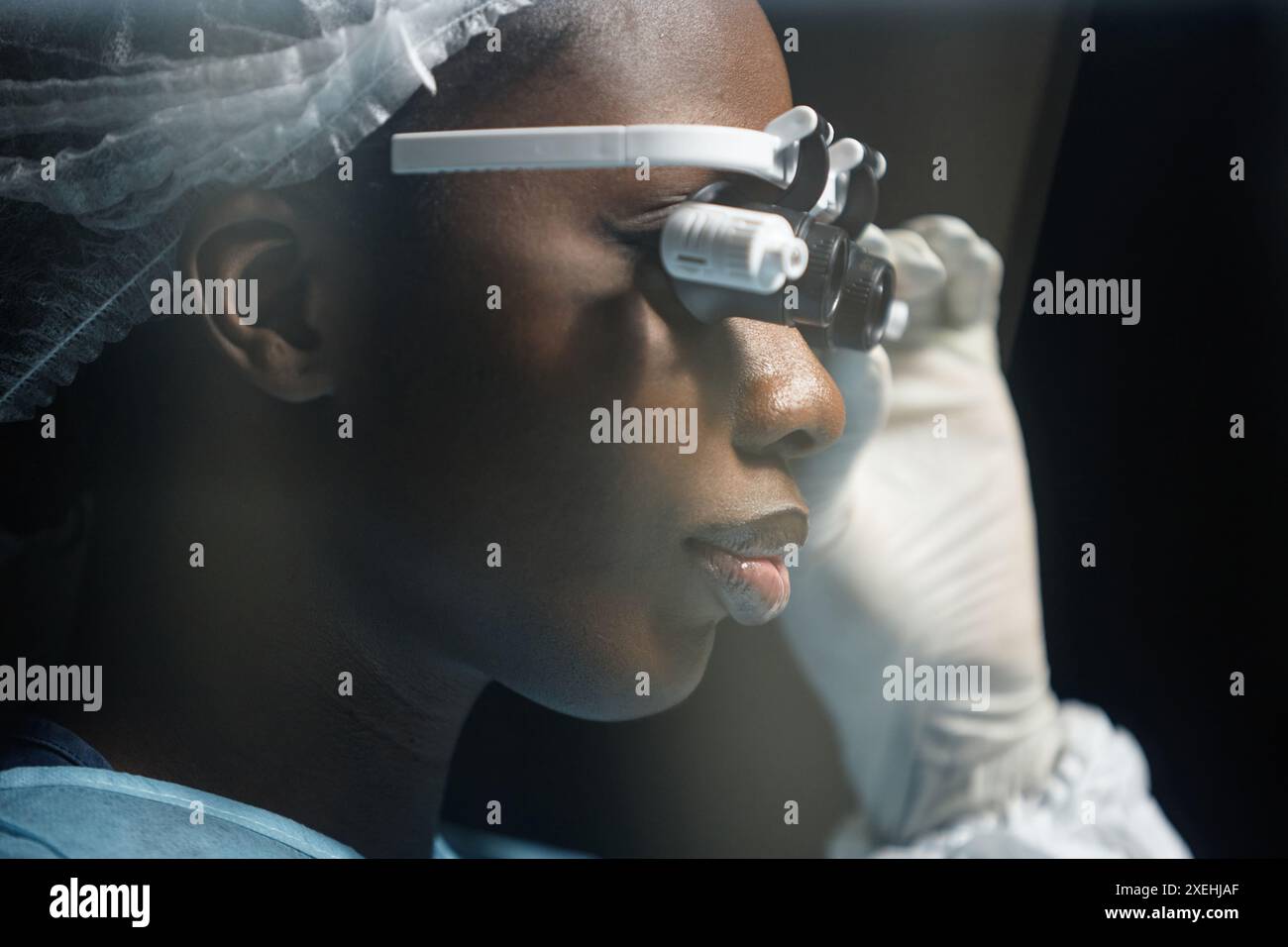 Side view closeup of young African American woman as female surgeon ...