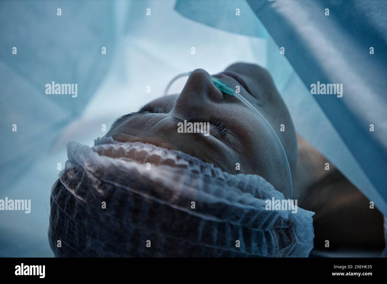 Woman lying on operating table hi-res stock photography and images - Alamy