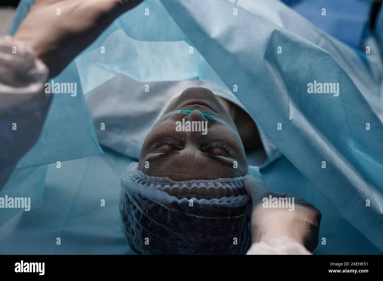 Woman lying on operating table hi-res stock photography and images - Alamy