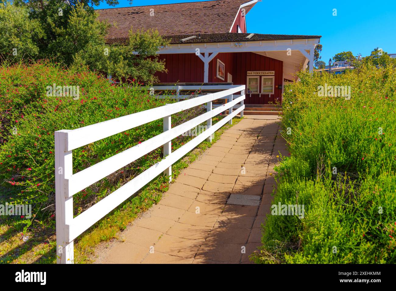 San Diego, California - April 16, 2024: White fence along a brick ...