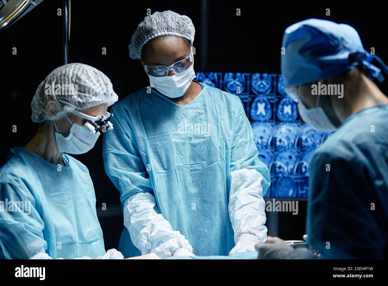 Waist up portrait of surgical team performing surgery on unrecognizable ...