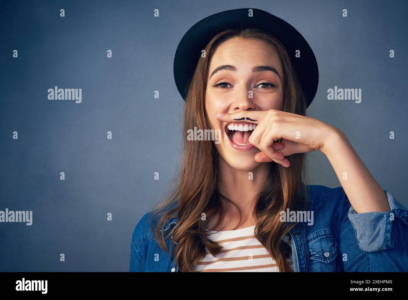 Woman, finger and mustache on studio background with portrait for ...