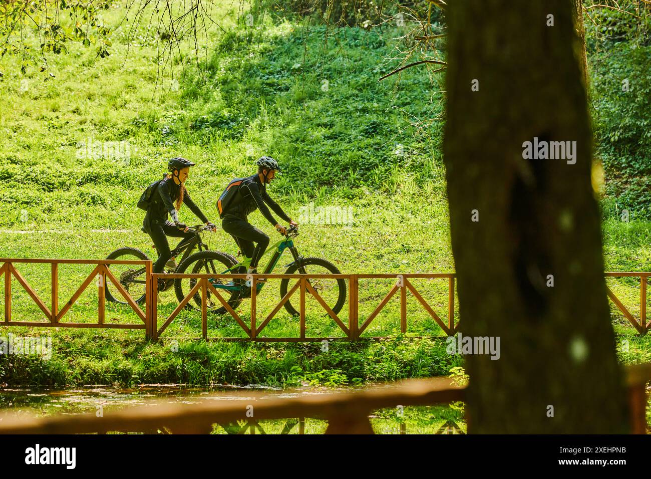 A blissful couple, adorned in professional cycling gear, enjoys a ...