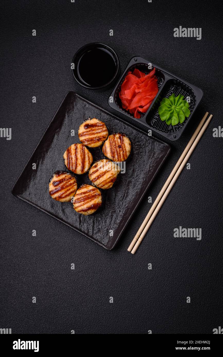 Delicious warm sushi roll with tuna, salmon, shrimp, cucumber and cream ...