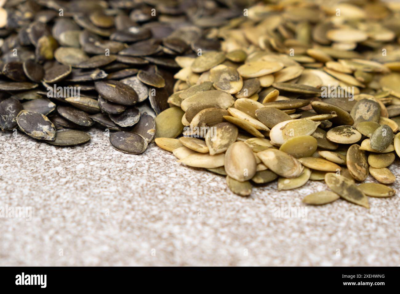 Different types of peeled pumpkin seeds, close-up Stock Photo - Alamy