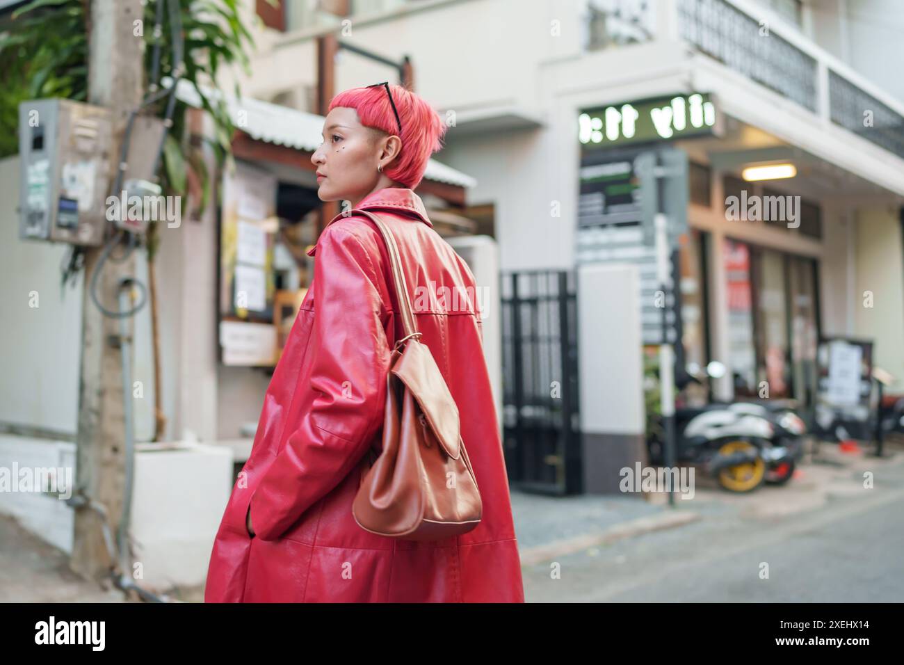 Gen z girl leather fashion with punk Asian woman tourist of local city ...