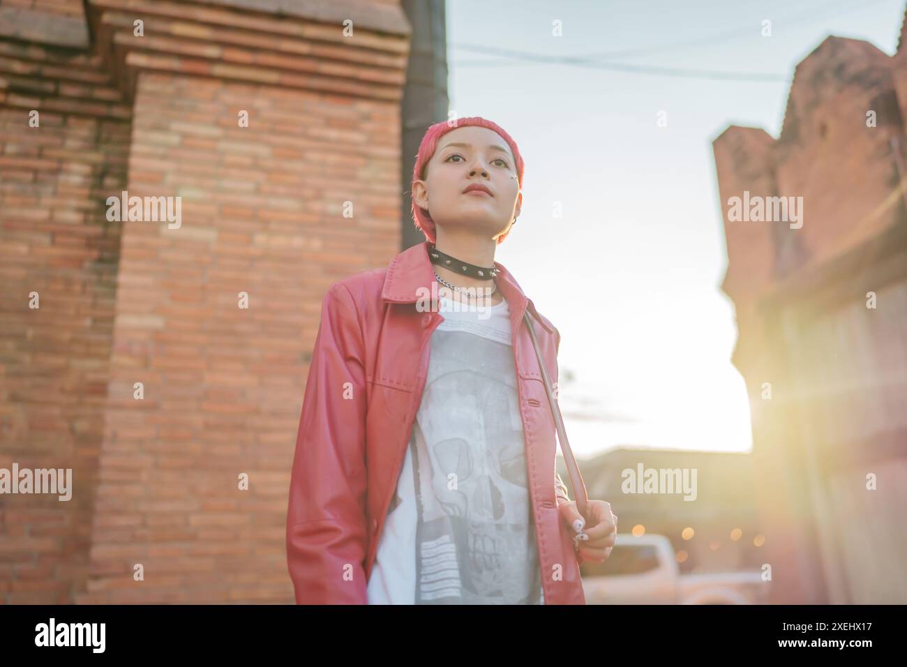 Gen z girl leather fashion with punk Asian woman tourist of local city ...