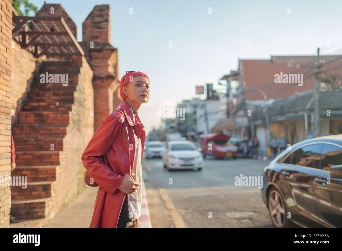 Gen z girl leather fashion with punk Asian woman tourist of local city ...