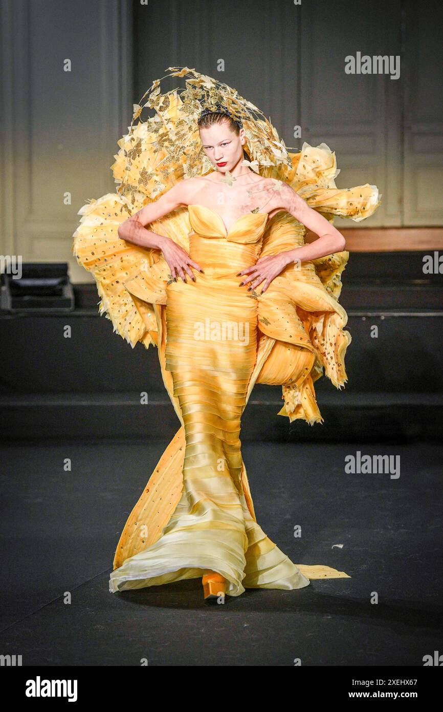 Paris, France. 27th June, 2024. A model walks the runway during the ...