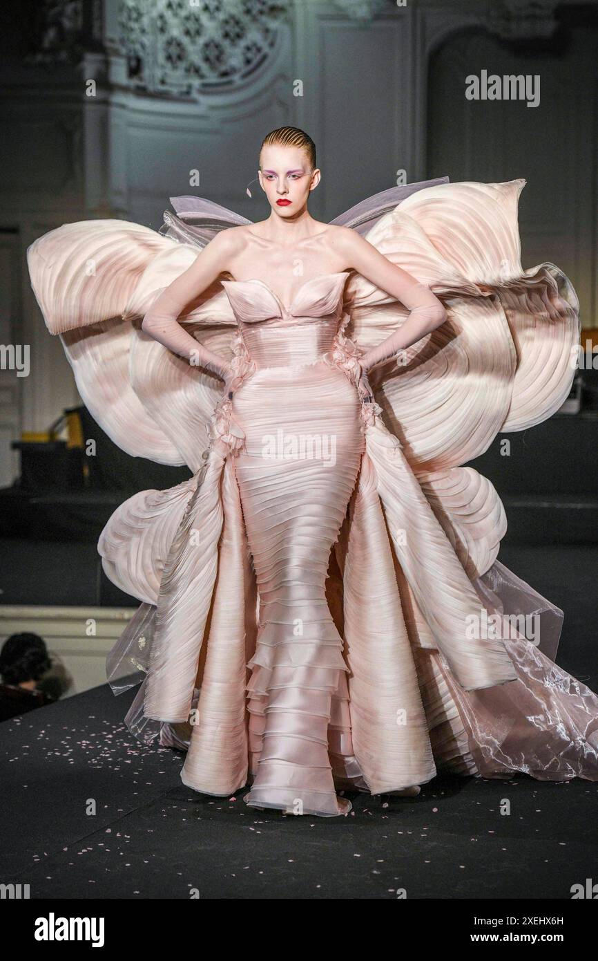 Paris, France. 27th June, 2024. A model walks the runway during the ...