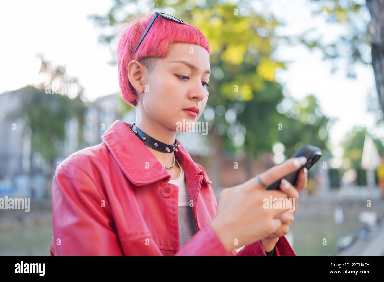 Traveler girl using mobile phone on street in city Fashion gen z asian ...