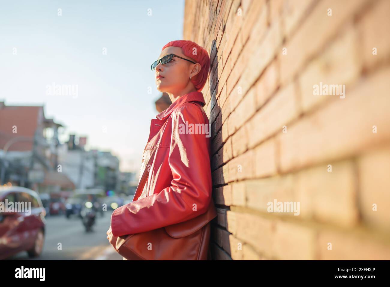 Gen z girl leather fashion with punk Asian woman tourist of local city ...