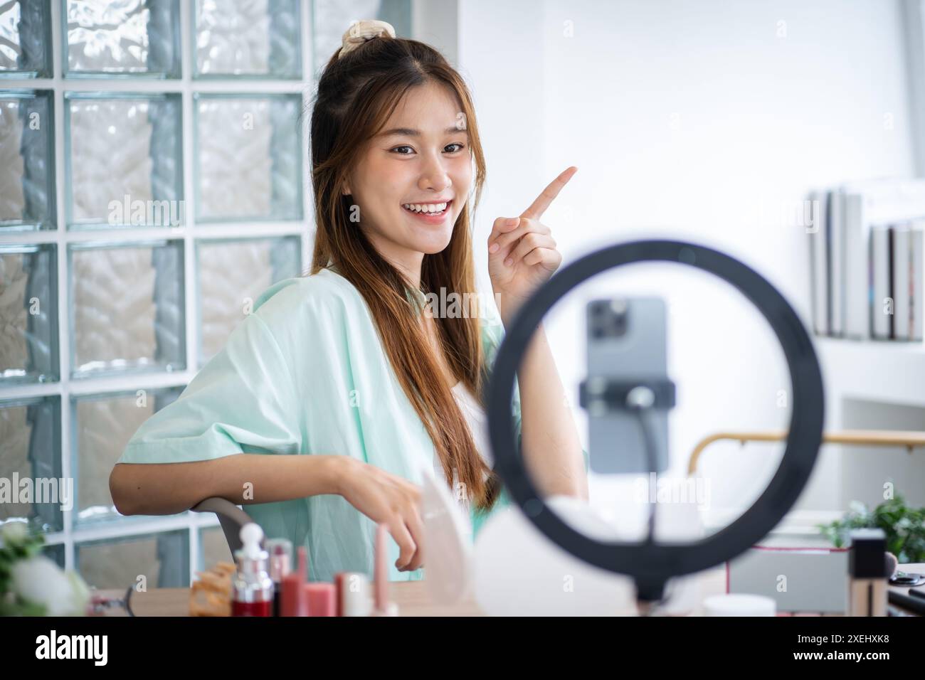 Beauty influencer Asian girl makeup artist . pretty woman looking at ...