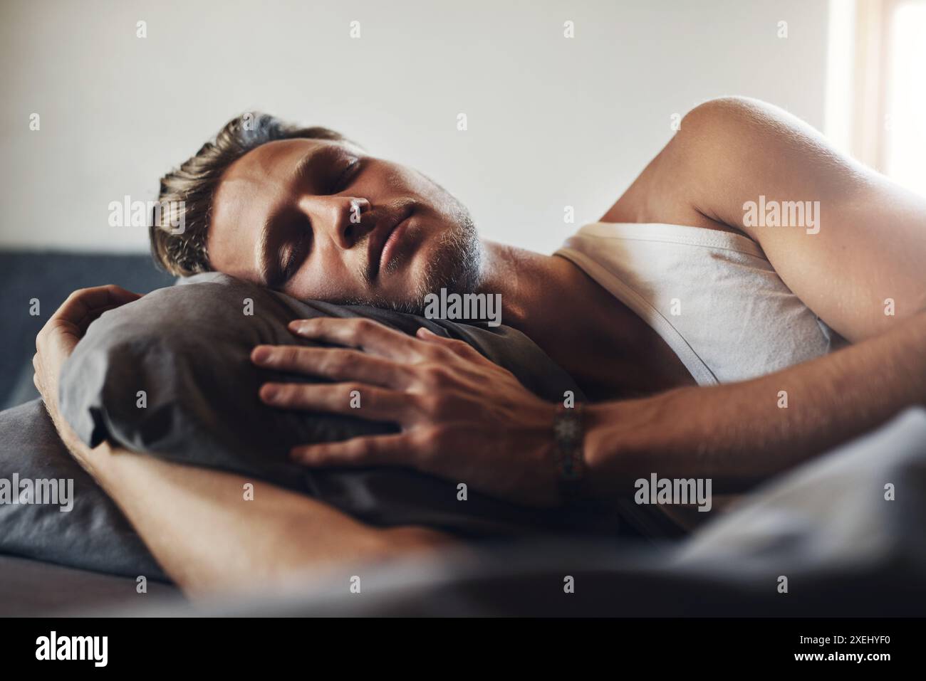 Lonely man sleeping bed smiling hi-res stock photography and images - Alamy