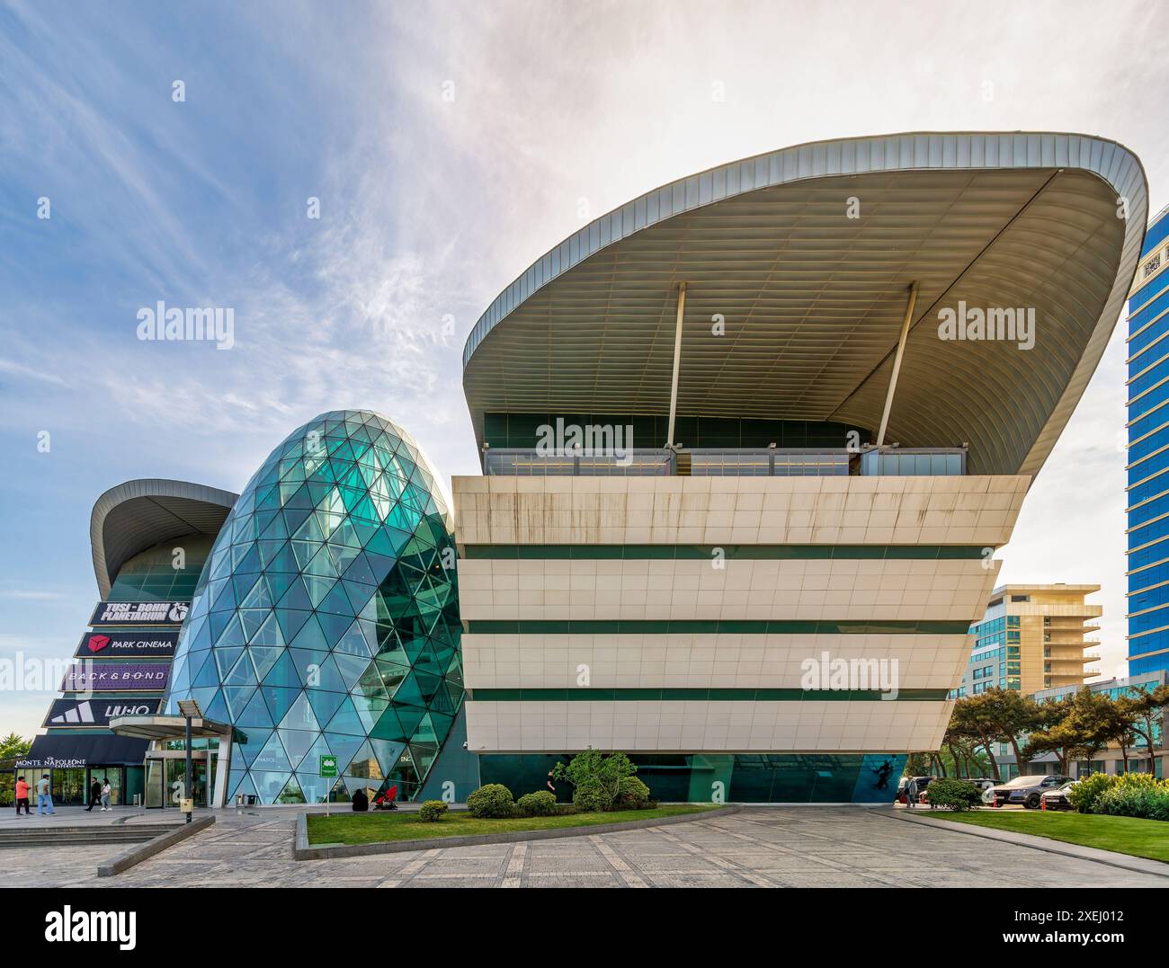 Baku, Azerbaijan - May 10 2024: Few people walk near the modern design ...