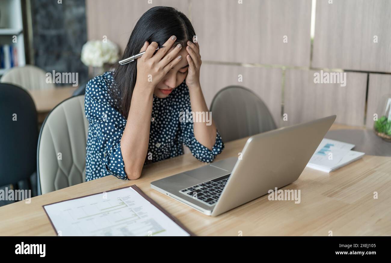 Burnout concept. Asian Business woman touching forehead having headache ...
