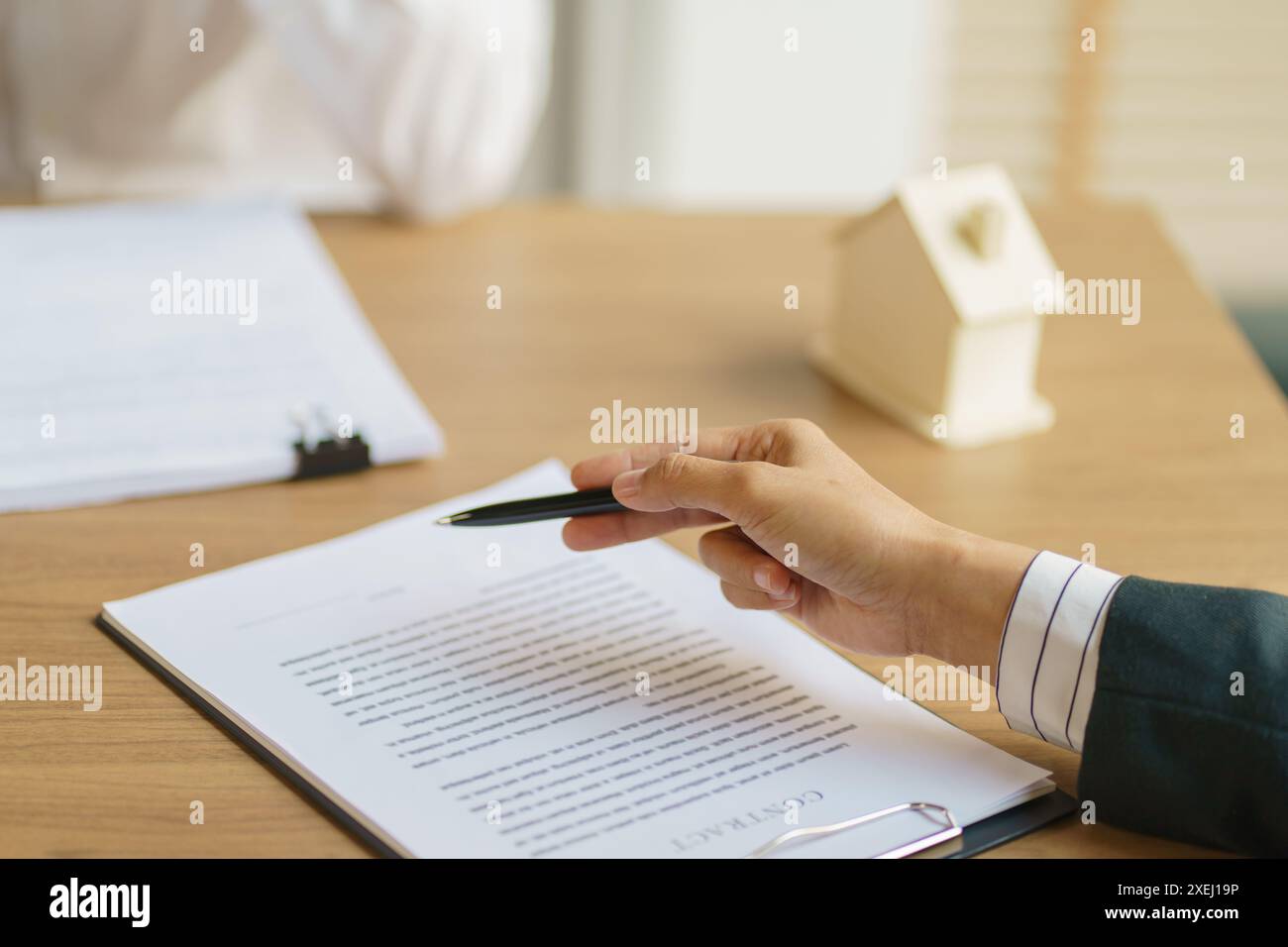 Business people signing legal certified hi-res stock photography and ...