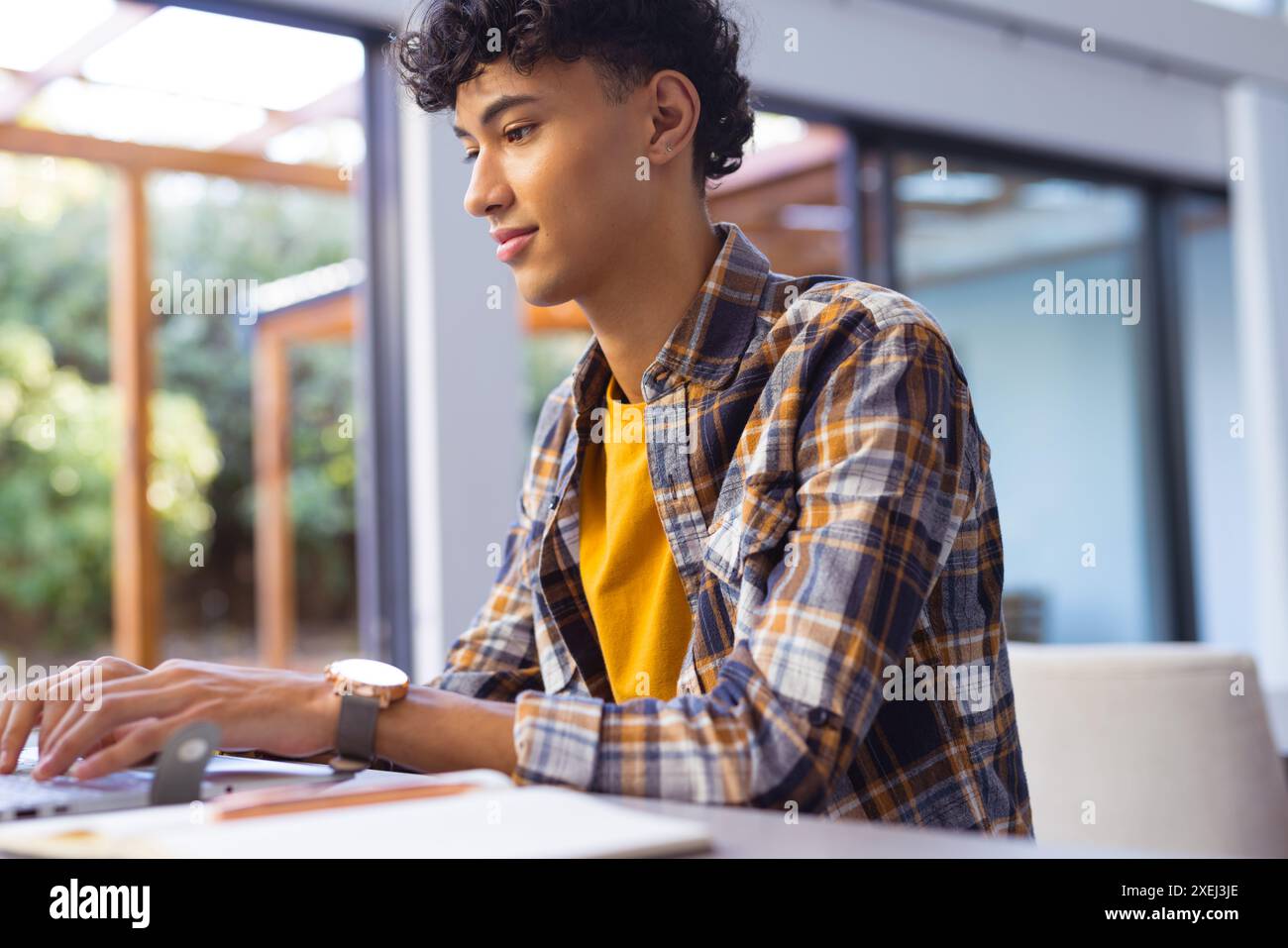 Boy working on laptop computer hi-res stock photography and images - Alamy