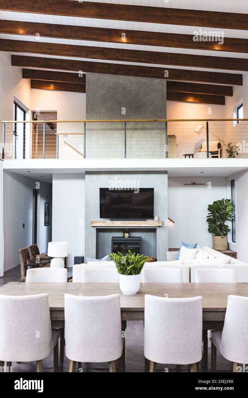 Modern living room with high ceilings, large TV, and stylish furniture, copy space Stock Photo ...