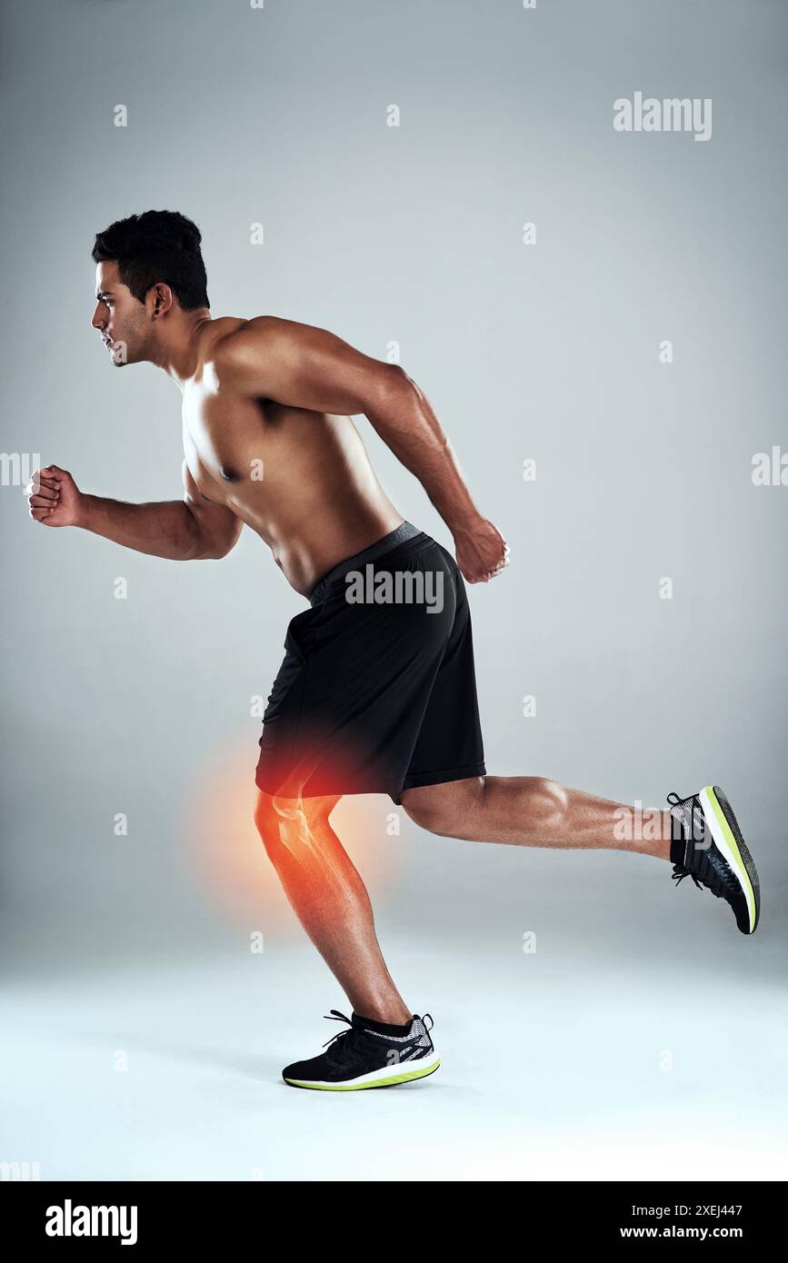 Running, fitness and man in studio with knee pain, physio and cramp at ...