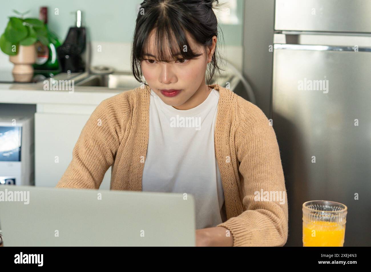 Happy young Asian Woman Successful working with laptop checking happy ...