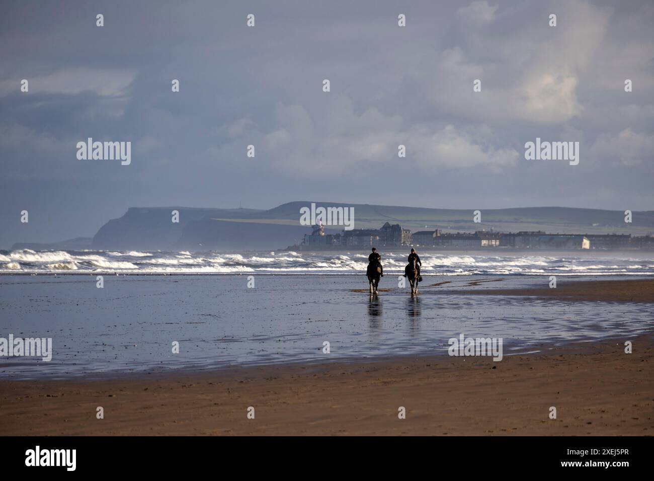 Two horse riders on beach hi-res stock photography and images - Alamy
