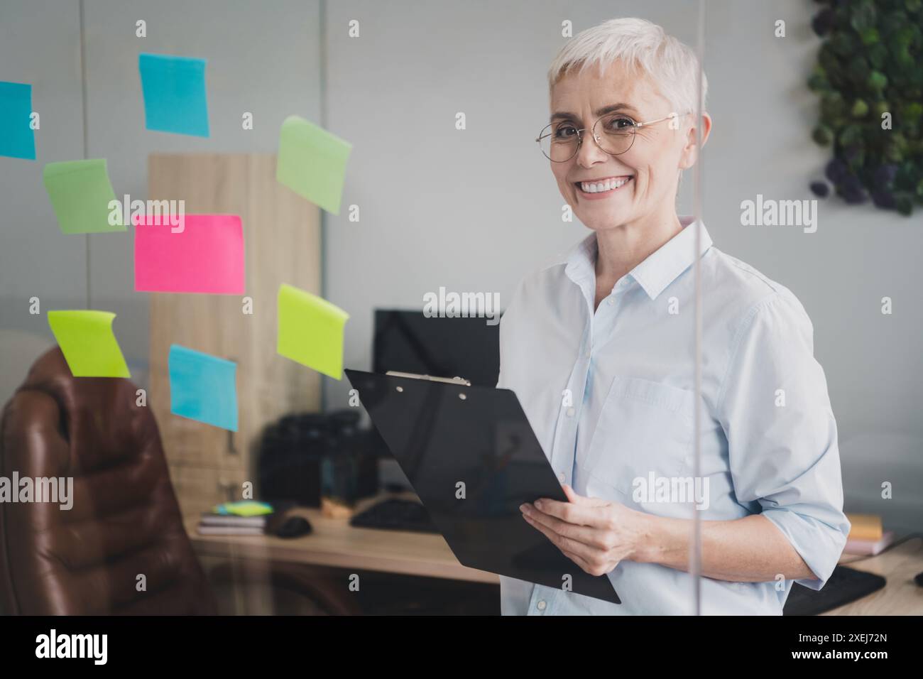 Photo of happy charming senior lady secretary wear formal shirt ...