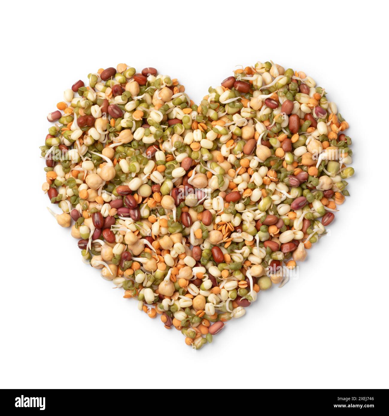 Mixture of colorful fresh sprouts in heart shape isolated on white ...