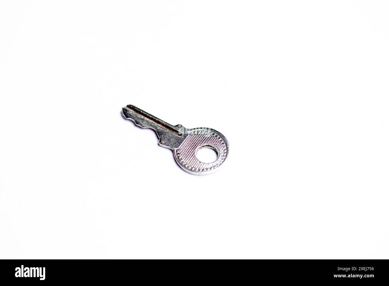 Key isolated on white background Stock Photo - Alamy