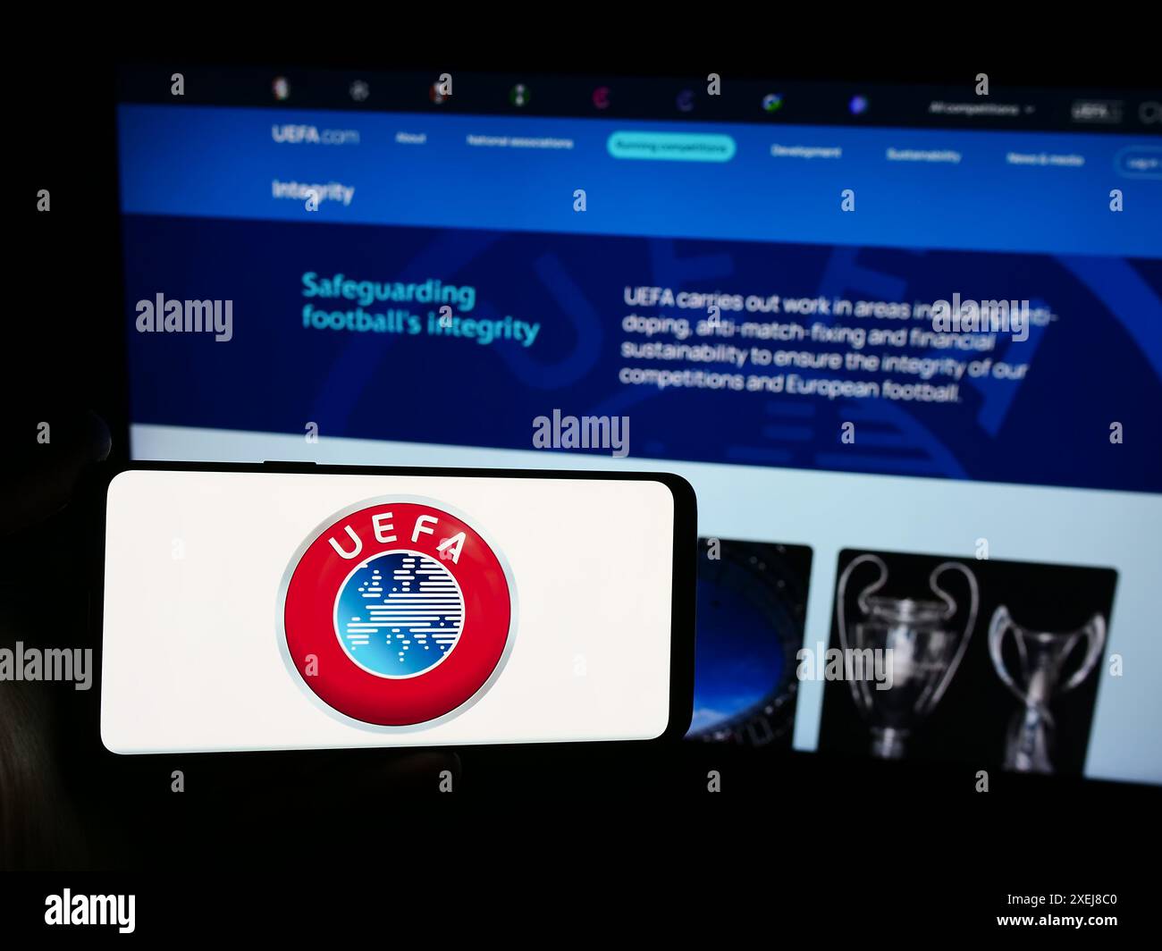 Person holding smartphone with logo of Union of European Football ...