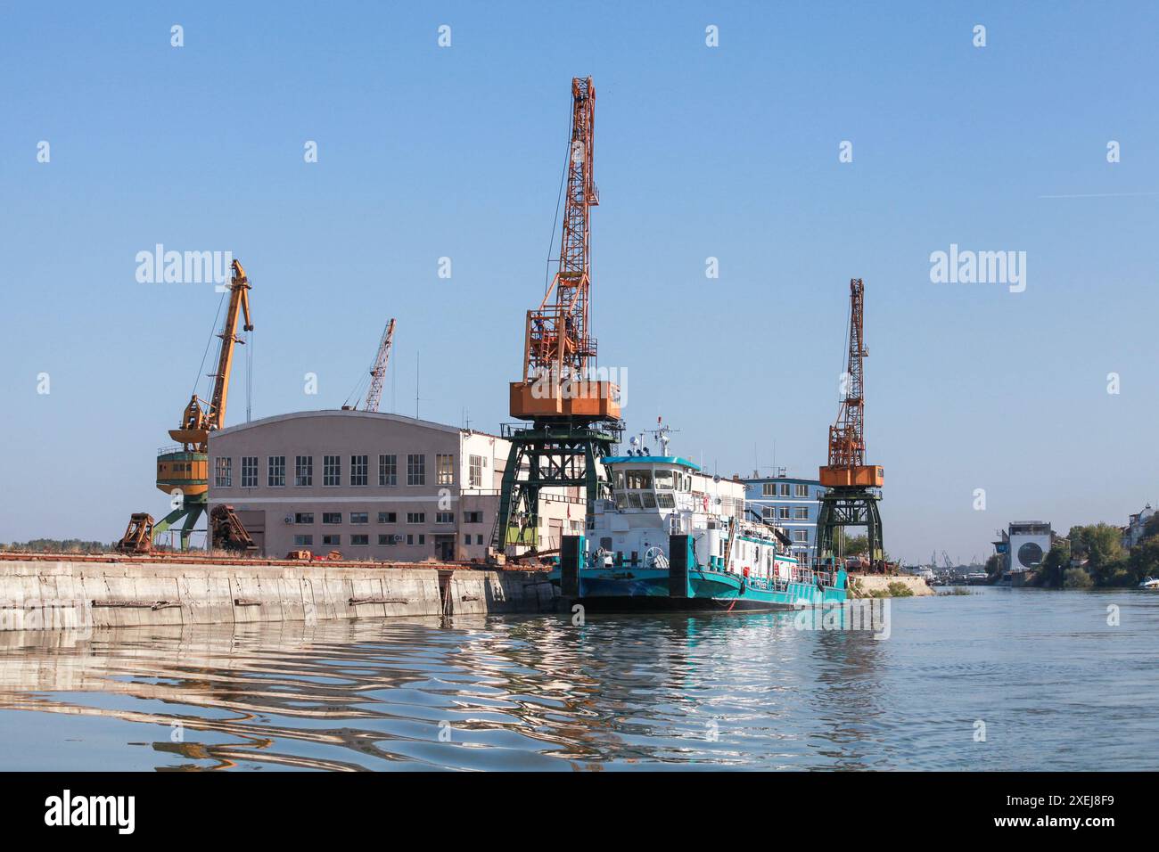 Harbor view of unloading cranes hi-res stock photography and images - Alamy