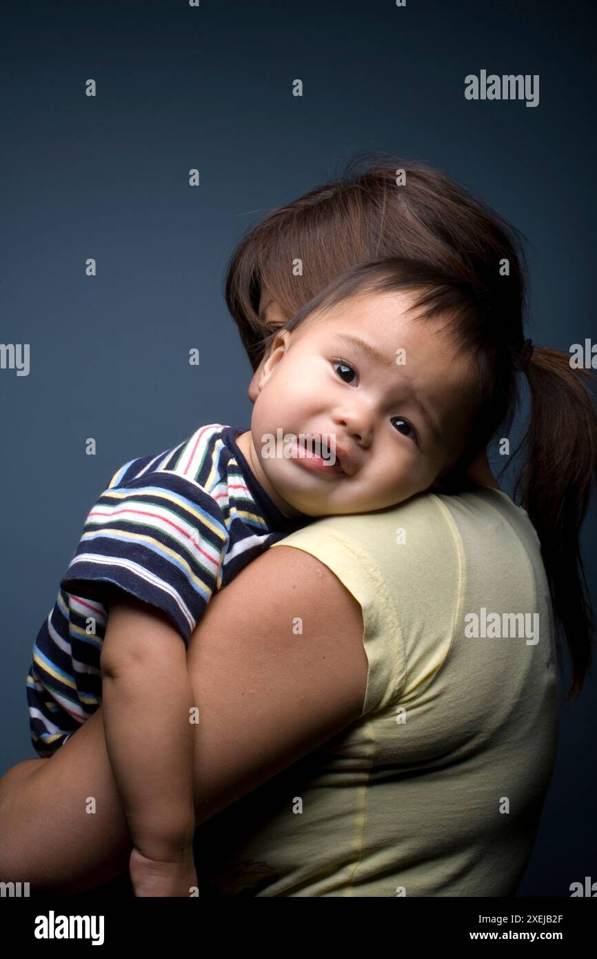 Japanese mom holds crying Japanese one year old baby Stock Photo - Alamy