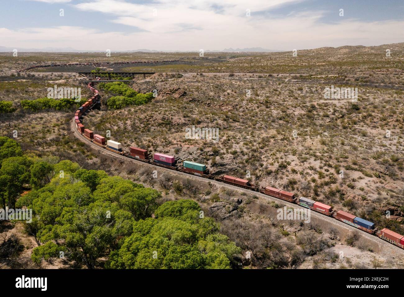 Aerial view of long container stack trains winding around curves Stock ...