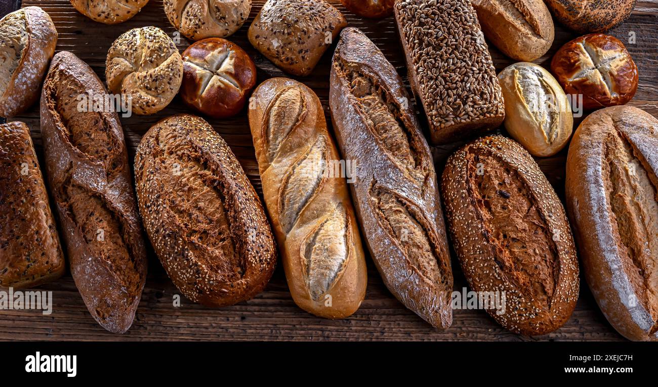 Assorted bakery products including loaves of bread and rolls Stock ...
