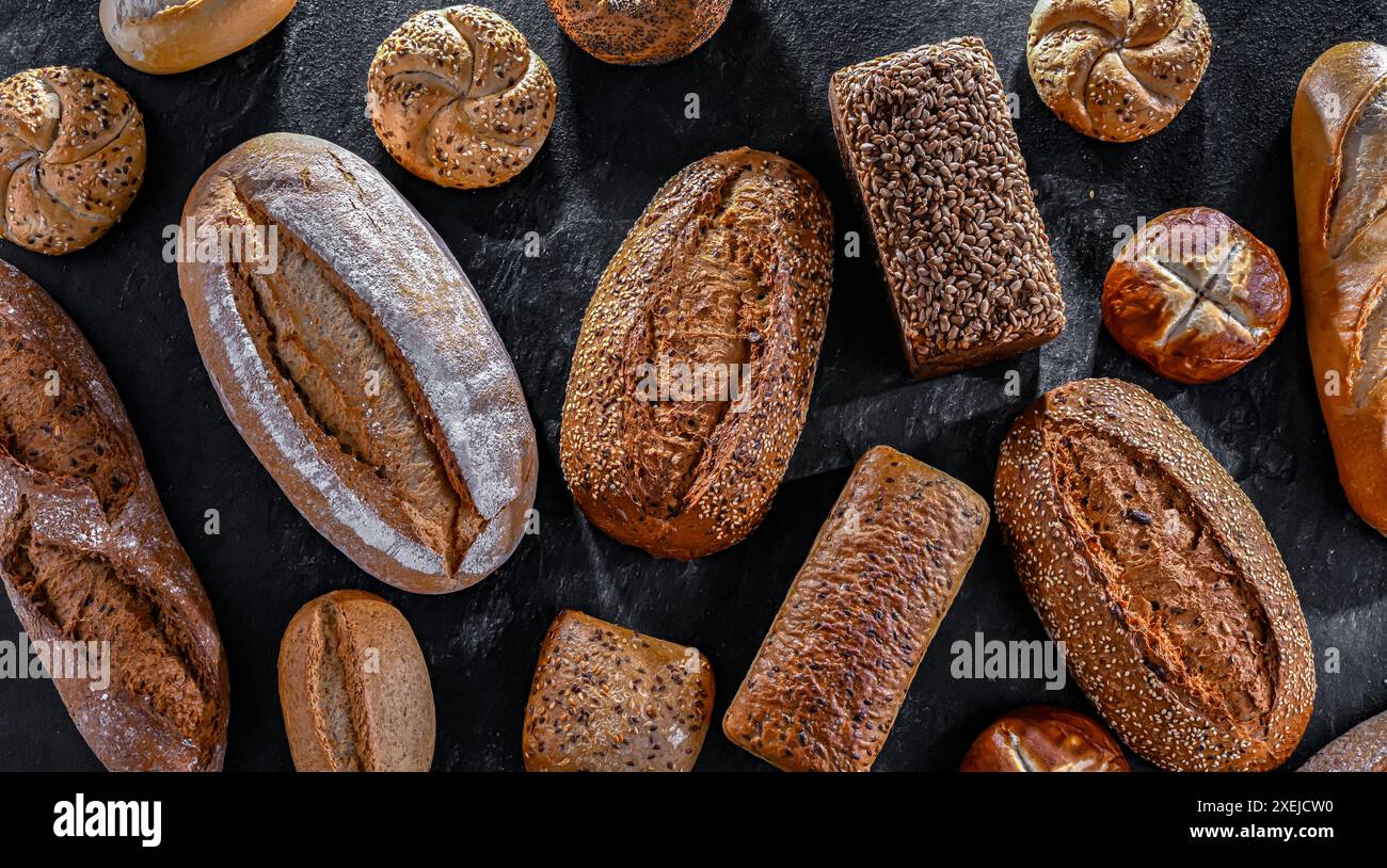 Assorted bakery products including loaves of bread and rolls Stock ...