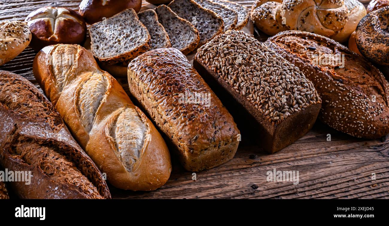 Assorted bakery products including loaves of bread and rolls Stock ...
