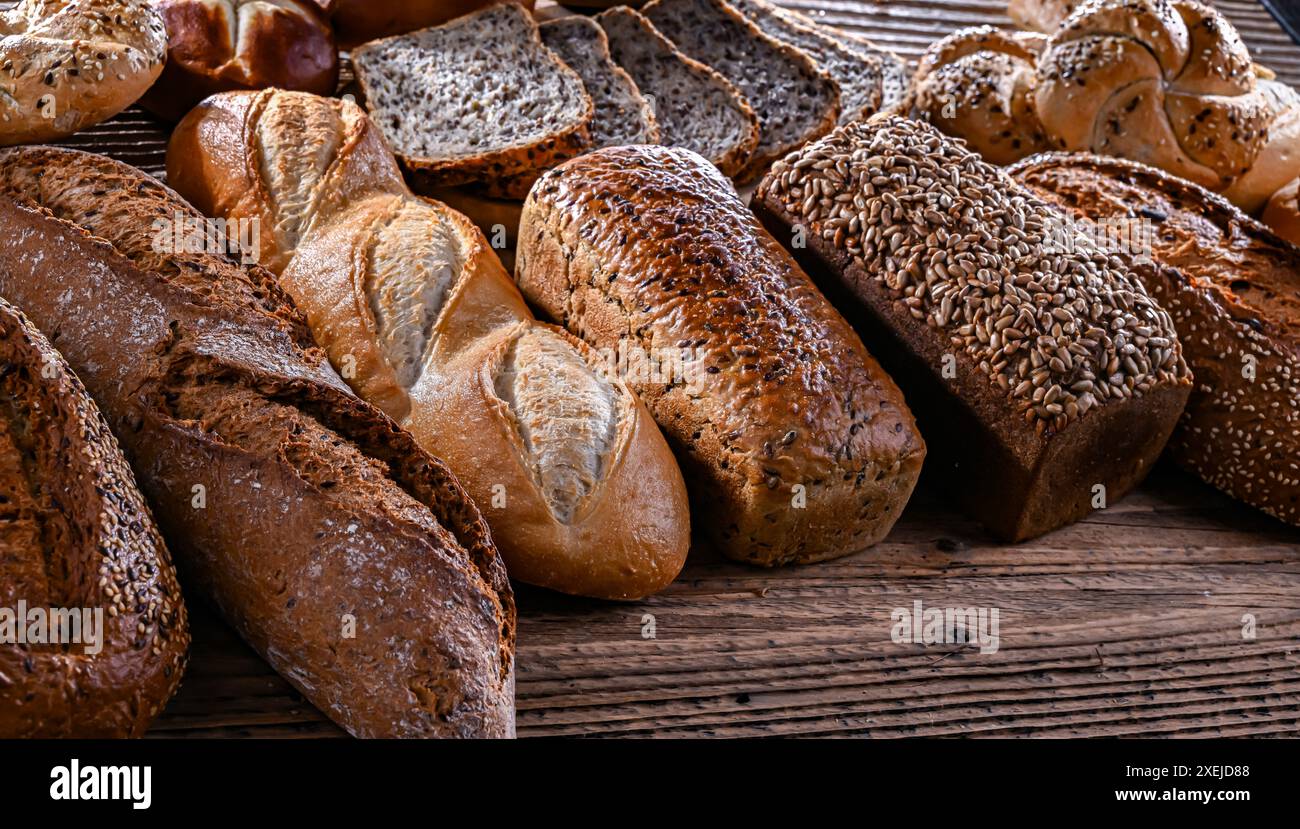 Assorted bakery products including loaves of bread and rolls Stock ...