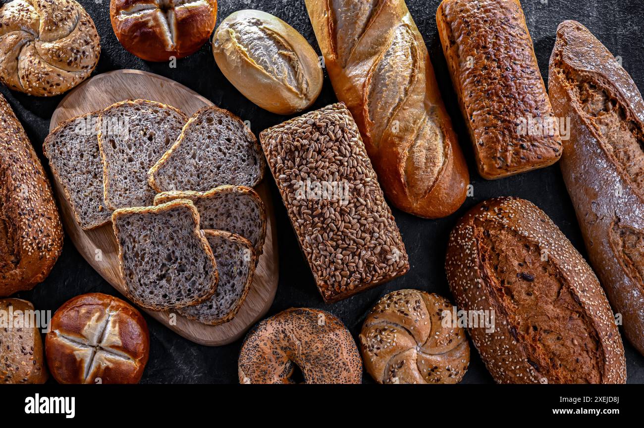 Assorted bakery products including loaves of bread and rolls Stock ...