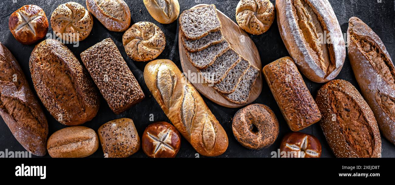 Assorted bakery products including loaves of bread and rolls Stock ...