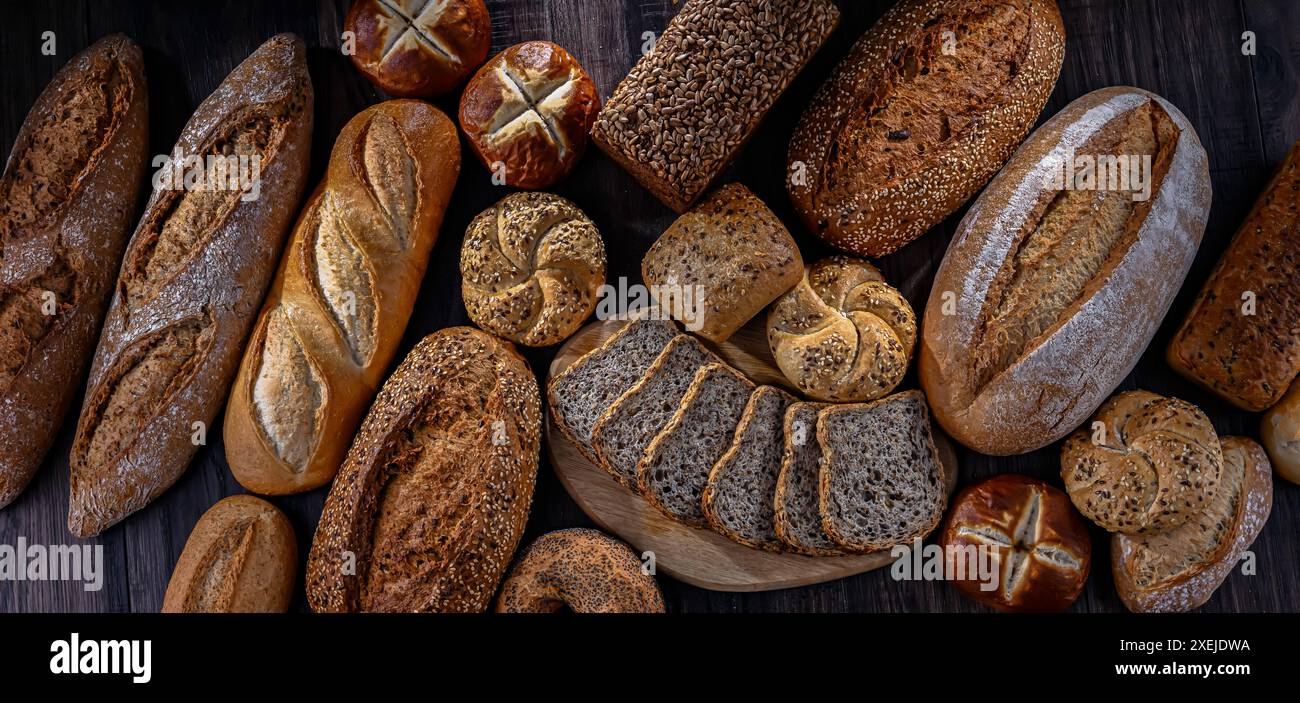 Assorted bakery products including loaves of bread and rolls Stock ...
