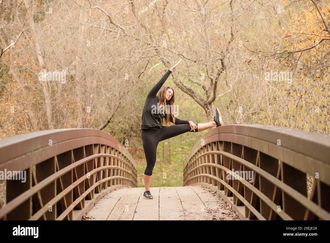 Women stretching on bridge outdoors Stock Photo - Alamy