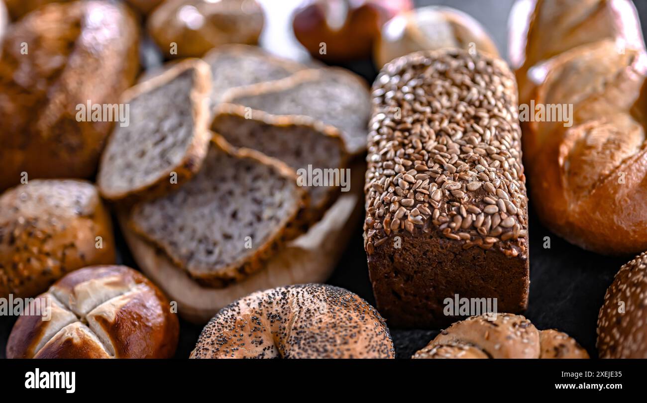 Assorted bakery products including loaves of bread and rolls Stock ...