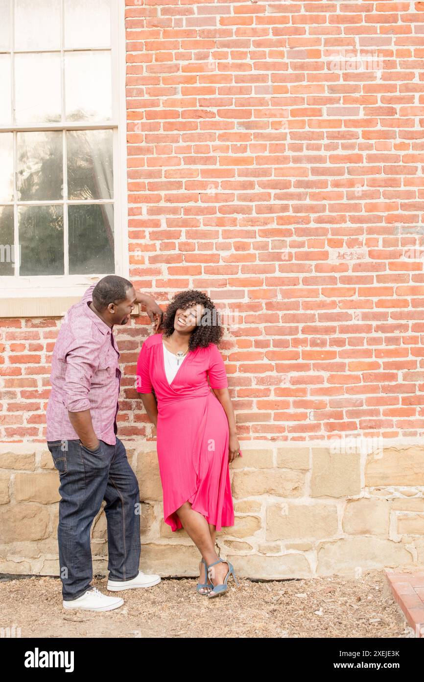 Young couple leaning against each other hi-res stock photography and ...