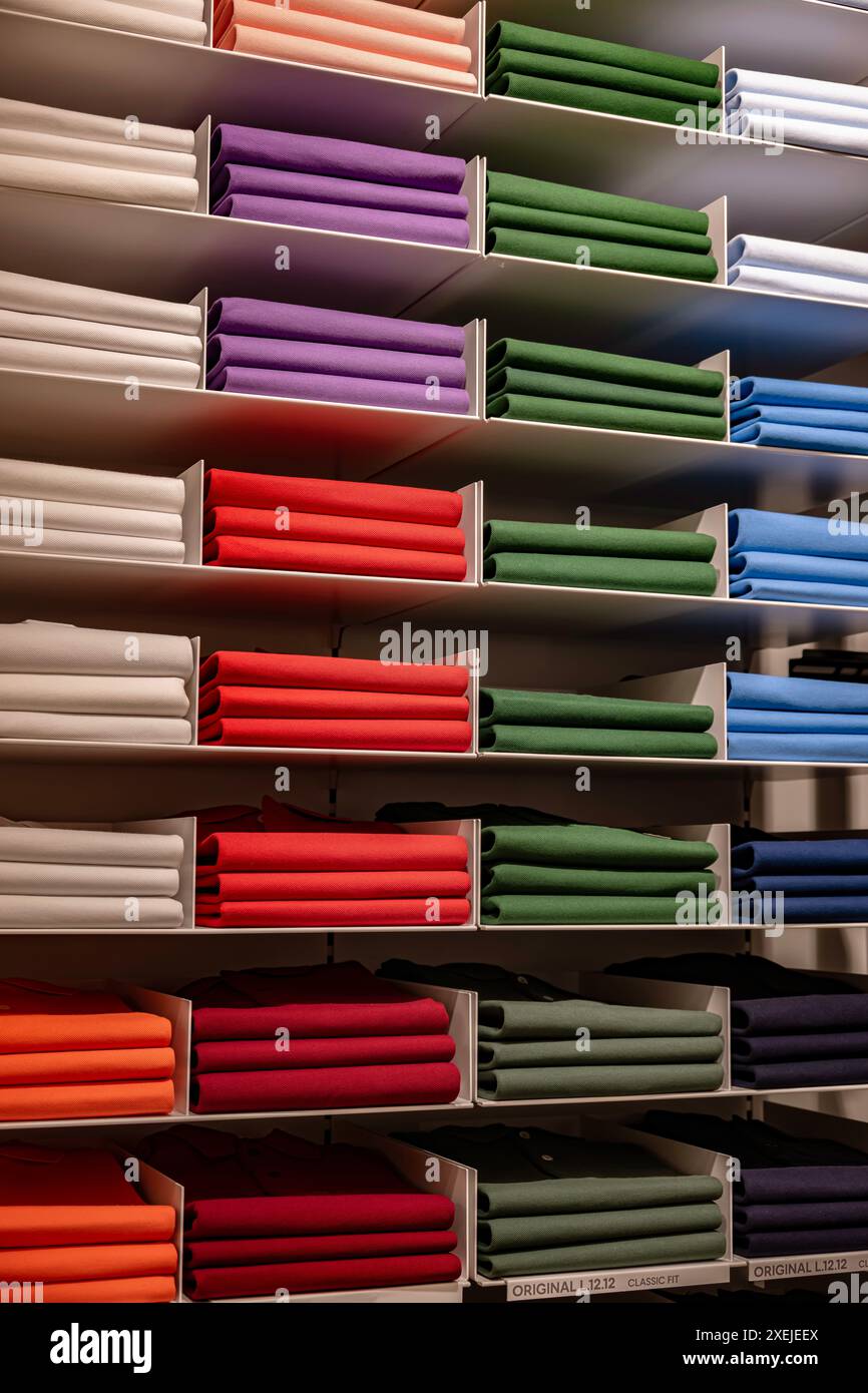 Clothing products on the shelf in a clothing store Stock Photo - Alamy