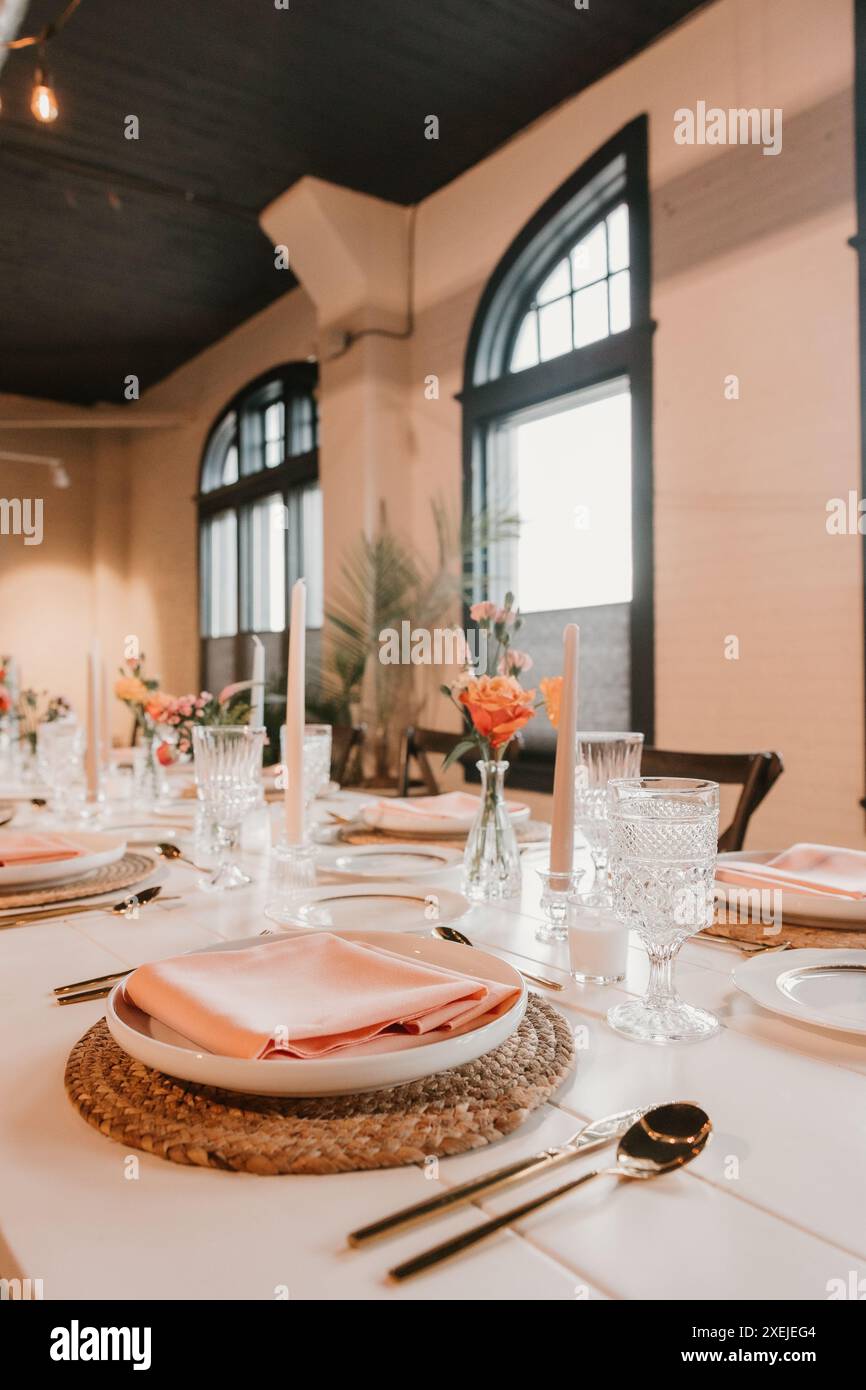 Elegant wedding reception table setting with peach, spring decorations ...