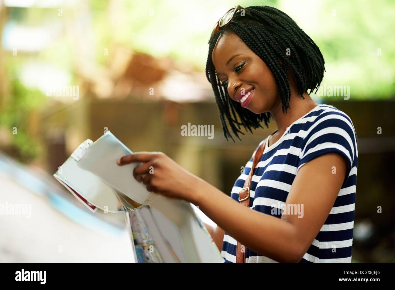 Black woman, outdoor and reading map for travel with holiday adventure ...