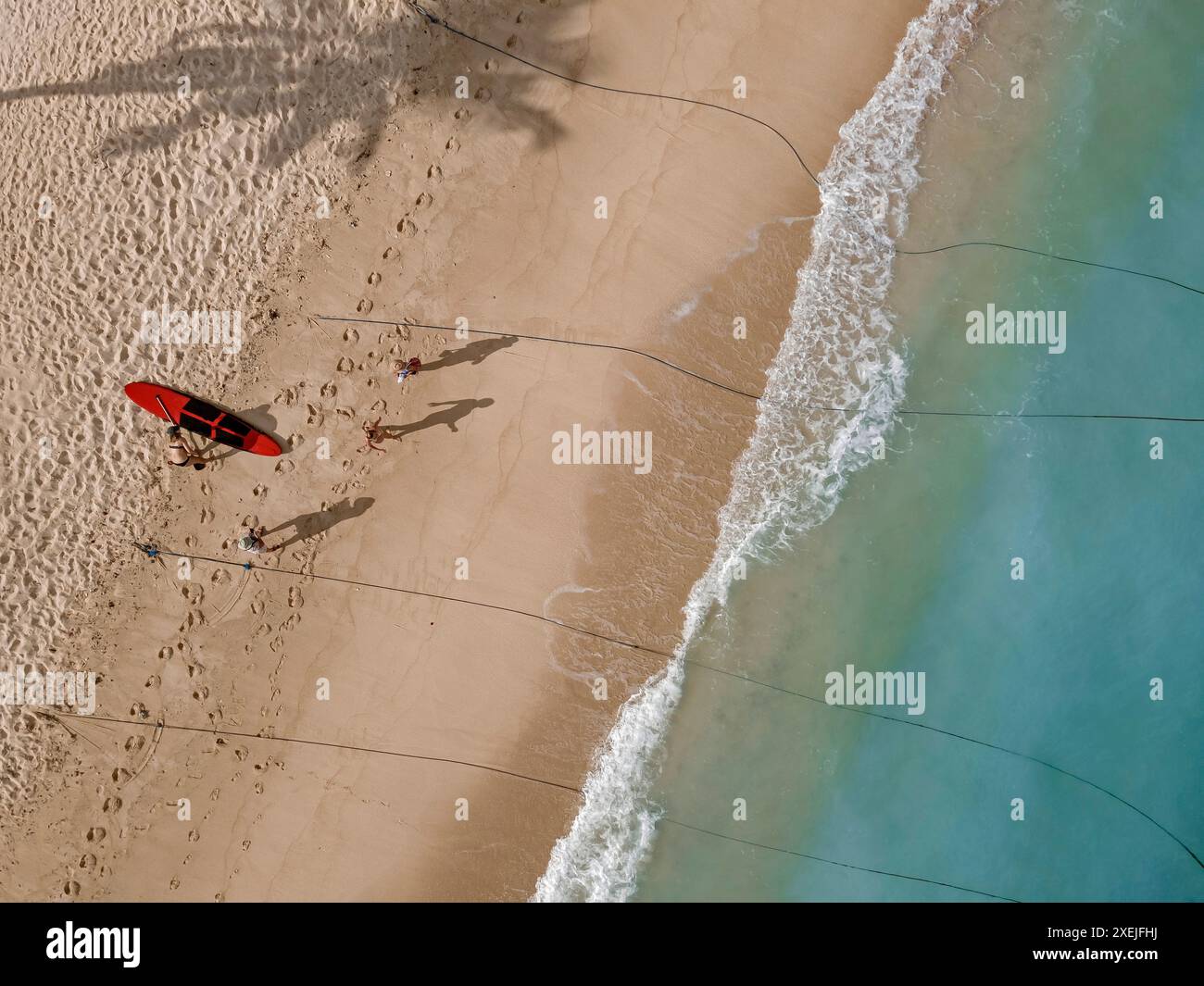 Aerial view of surfer at the sandy beach at sunny day Stock Photo - Alamy