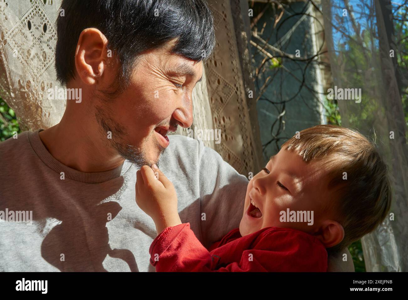 emotions of child and father Stock Photo - Alamy