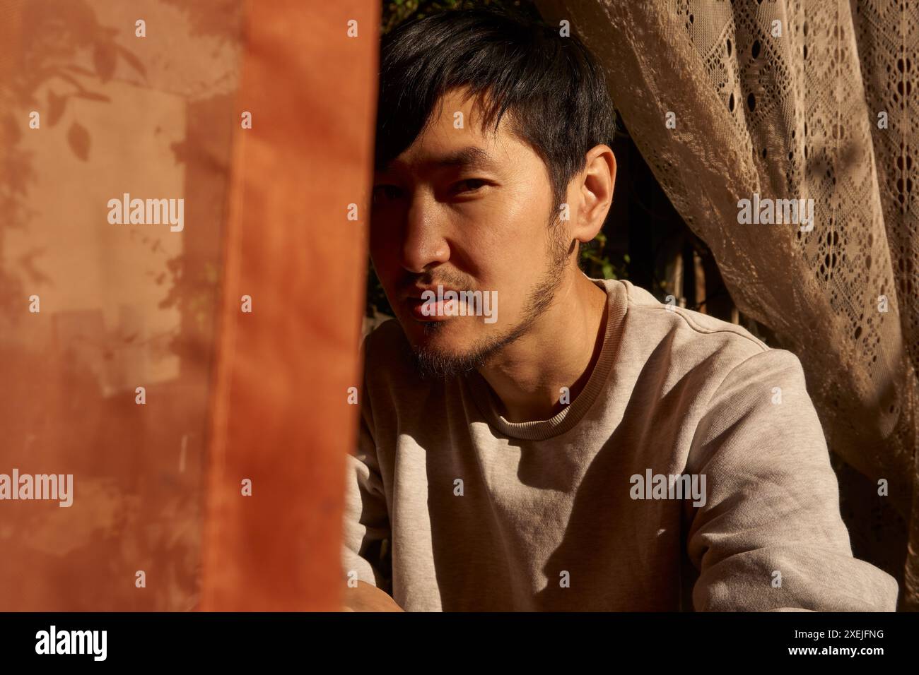 Asian man looking to camera hi-res stock photography and images - Alamy